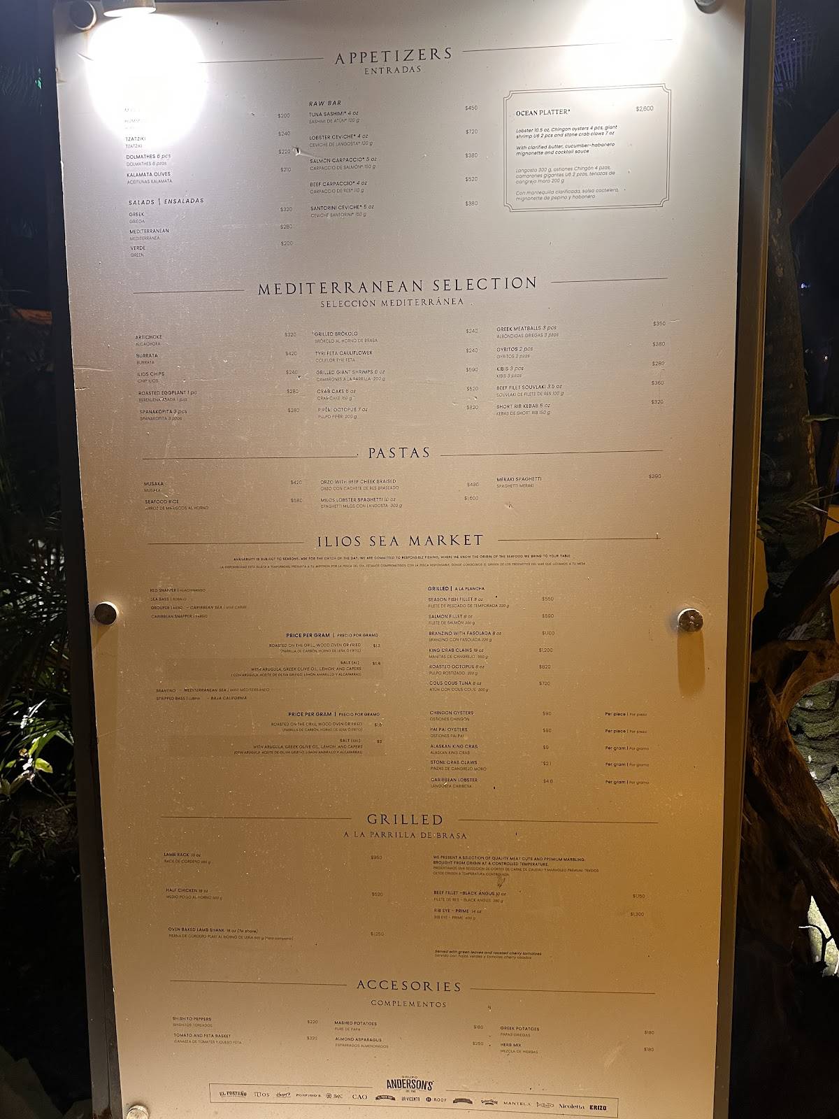 Menu at Ilios Greek restaurant in Tulum, Mexico